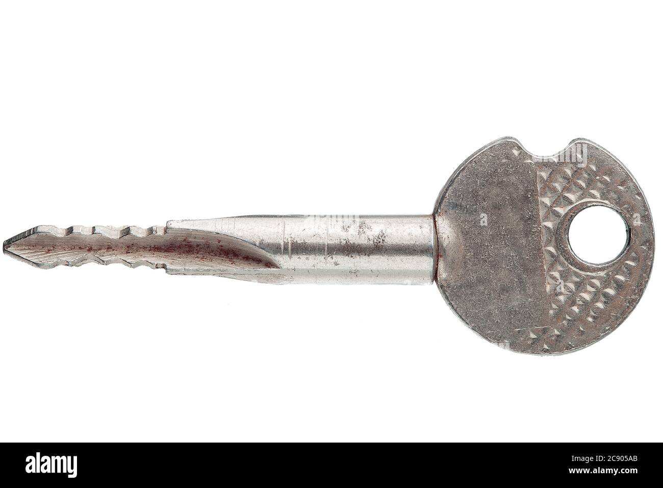 Key on a white background with reflection, the used old key in ...