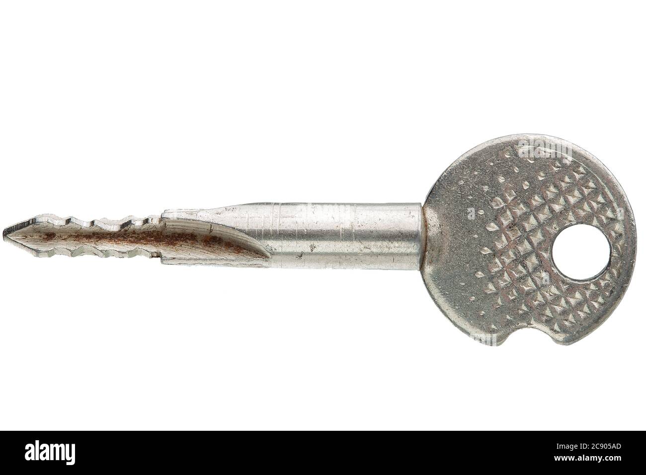 Key on a white background with reflection, the used old key in ...