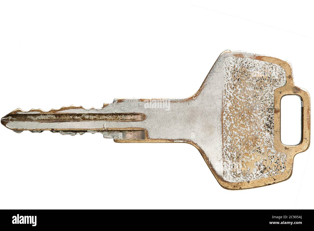 Key on a white background with reflection, the used old key in ...