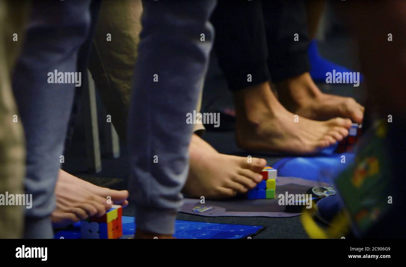 THE SPEED CUBERS, speedsolving Rubik s Cubes with feet, 2020. © Netflix ...