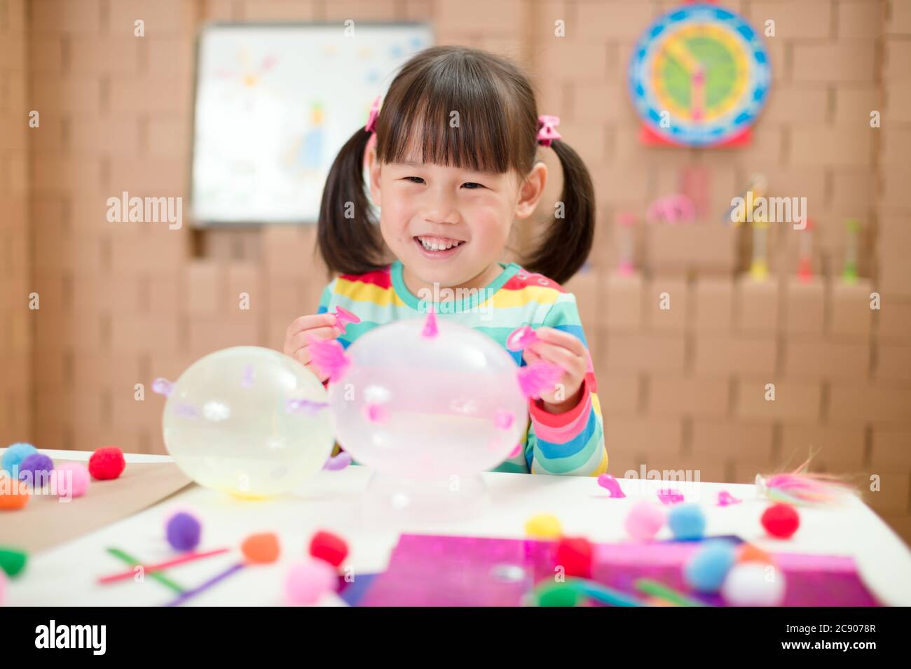 young girl making craft for homeschooling Stock Photo - Alamy