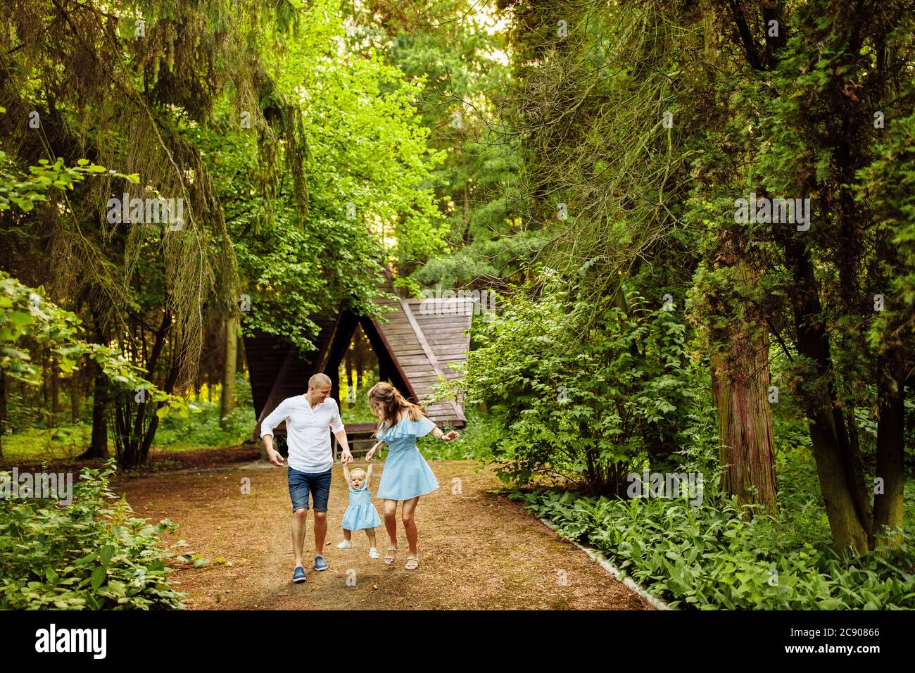 Loving young family walk at the park Stock Photo - Alamy