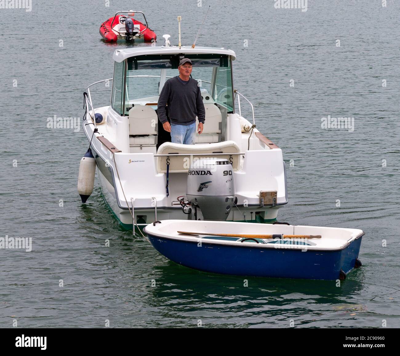 Male 30-50 onboard a Beneteau Antares 600 motor boat Stock Photo - Alamy