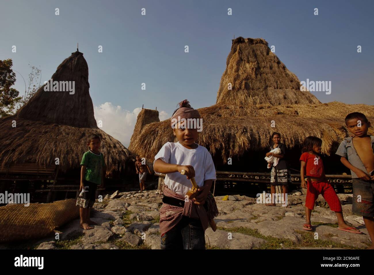 Portrait of school-age children in Praijing, a traditional village in ...