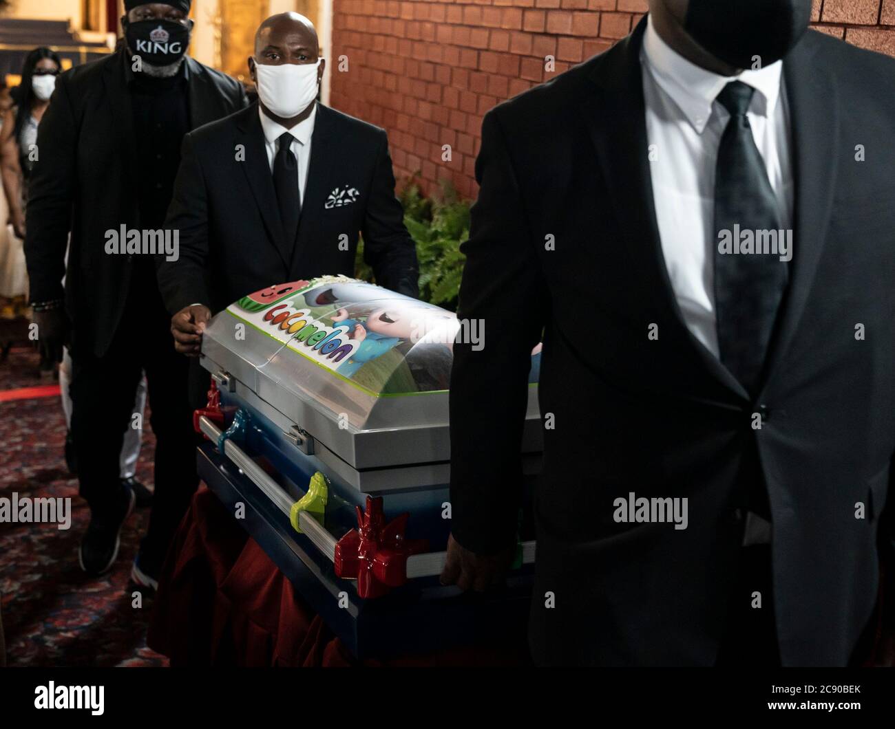 The casket draped in stickers from the tv show the Veggies of Davell ...