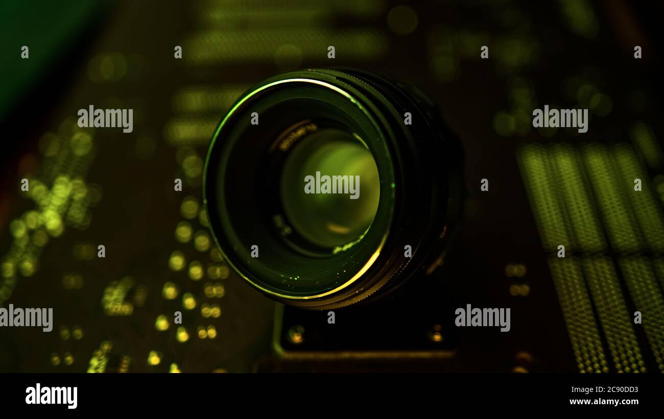Awesome camera lens in green and yellow lights, Camera concept Stock ...