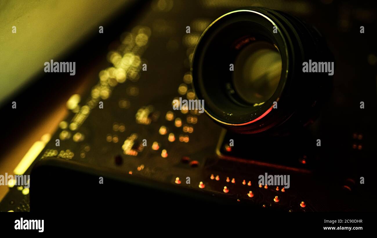 Awesome camera lens in yellow and red lights, Camera concept Stock ...