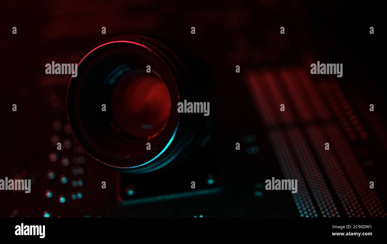 Awesome camera lens in red lights, Camera concept Stock Photo - Alamy