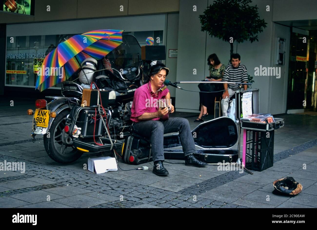 Street busker playing guitar, Munich, Germany Stock Photo - Alamy