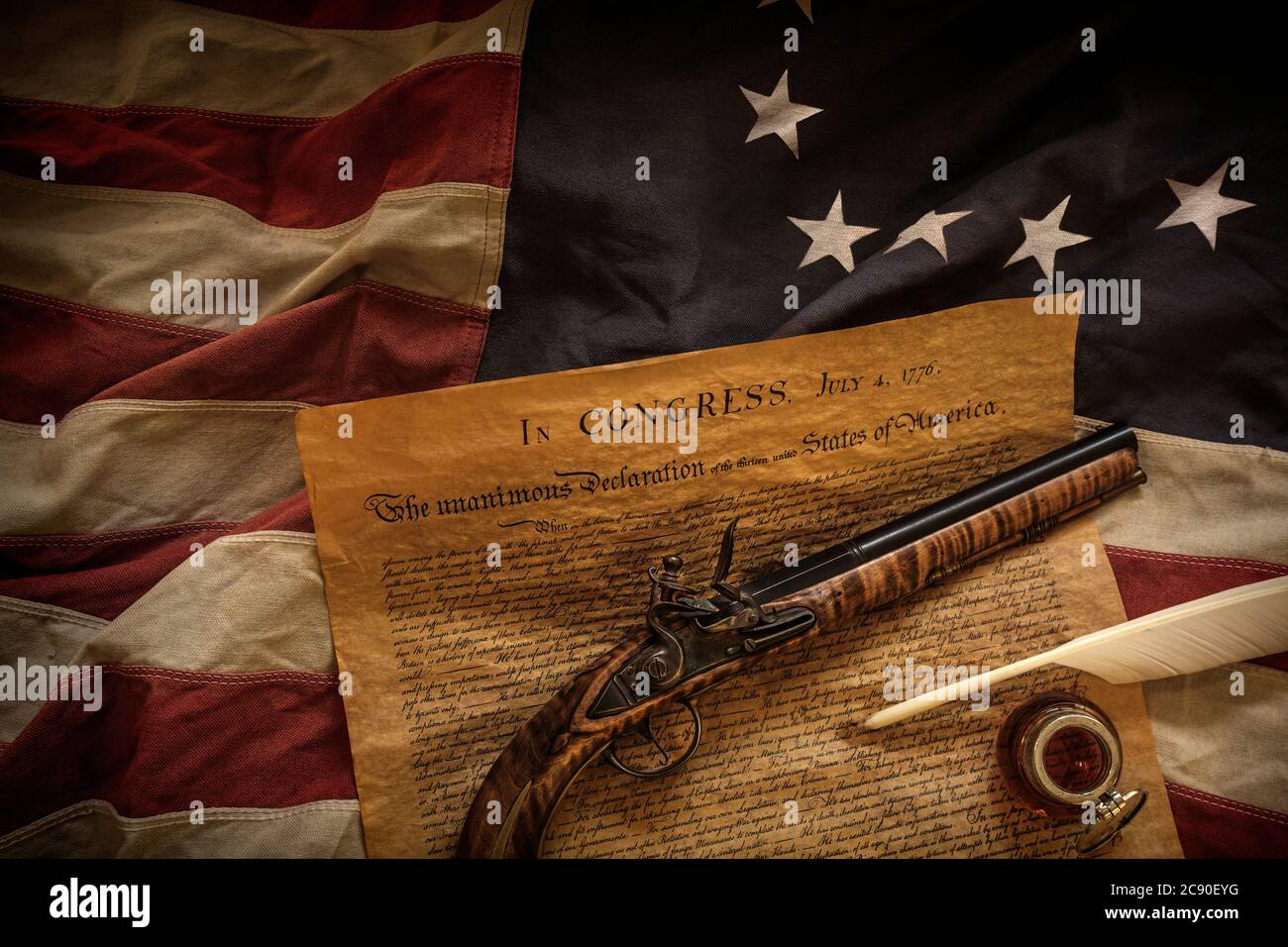 Flint and declaration of independence lying on American flag Stock ...