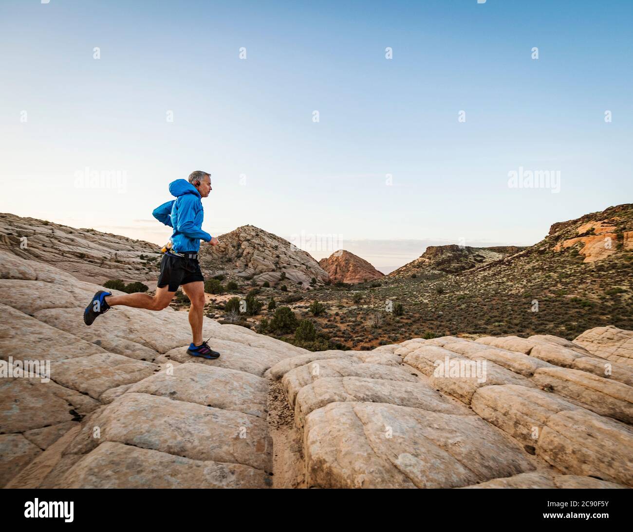 USA, Utah, St. George, Man running in rocky landscape Stock Photo - Alamy