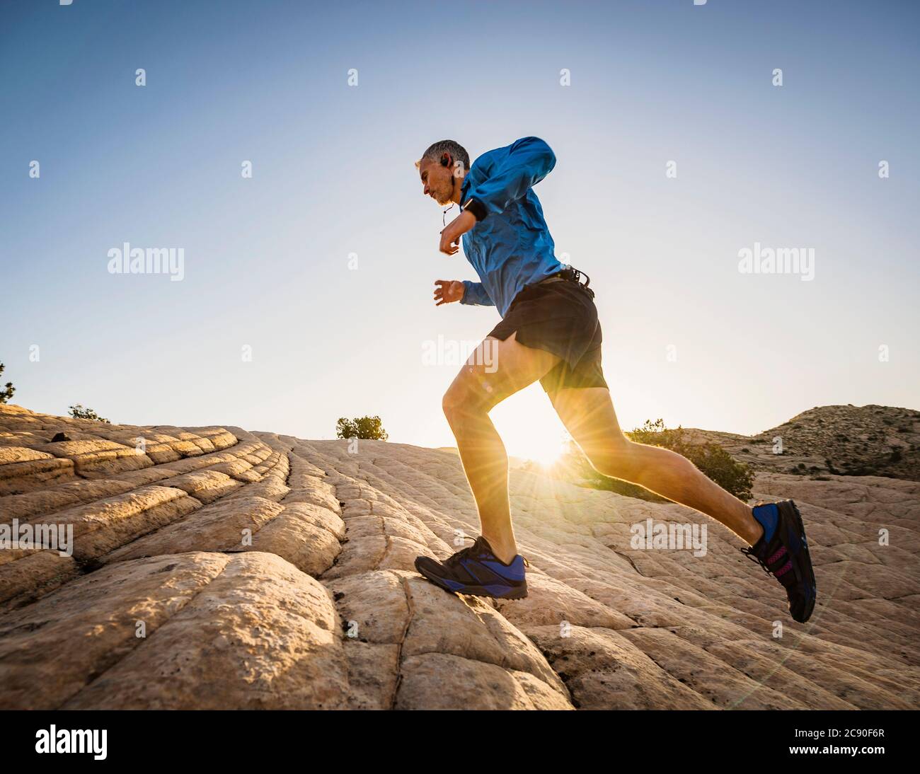 USA, Utah, St. George, Man running in rocky landscape Stock Photo - Alamy