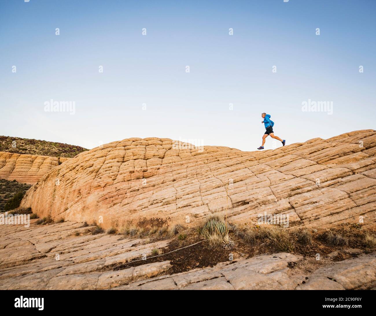 USA, Utah, St. George, Man running in rocky landscape Stock Photo - Alamy
