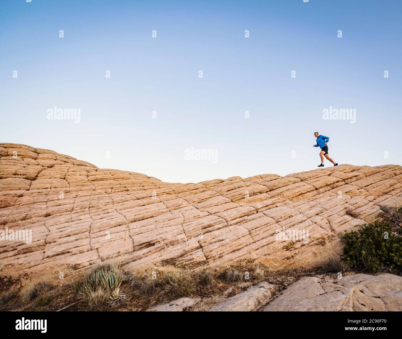 USA, Utah, St. George, Man running in rocky landscape Stock Photo - Alamy