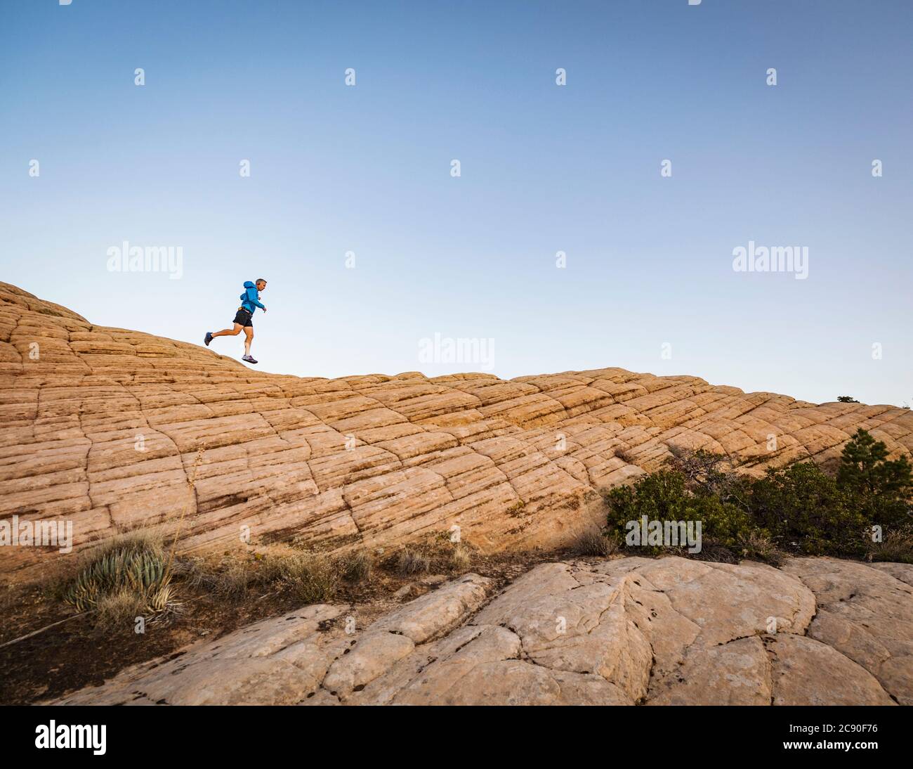 USA, Utah, St. George, Man running in rocky landscape Stock Photo - Alamy