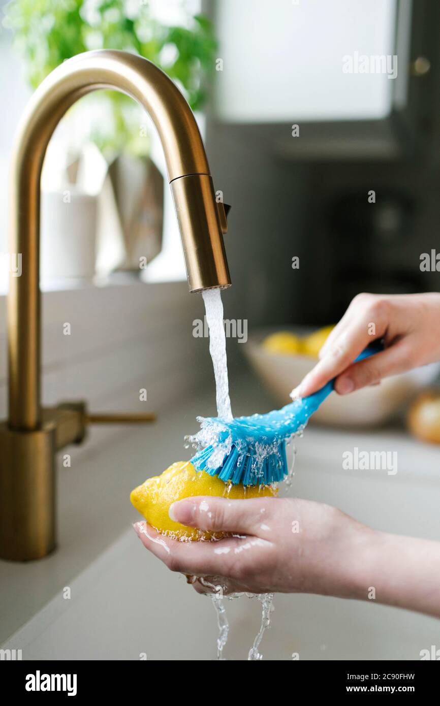 Hand washing fruit hi-res stock photography and images - Alamy