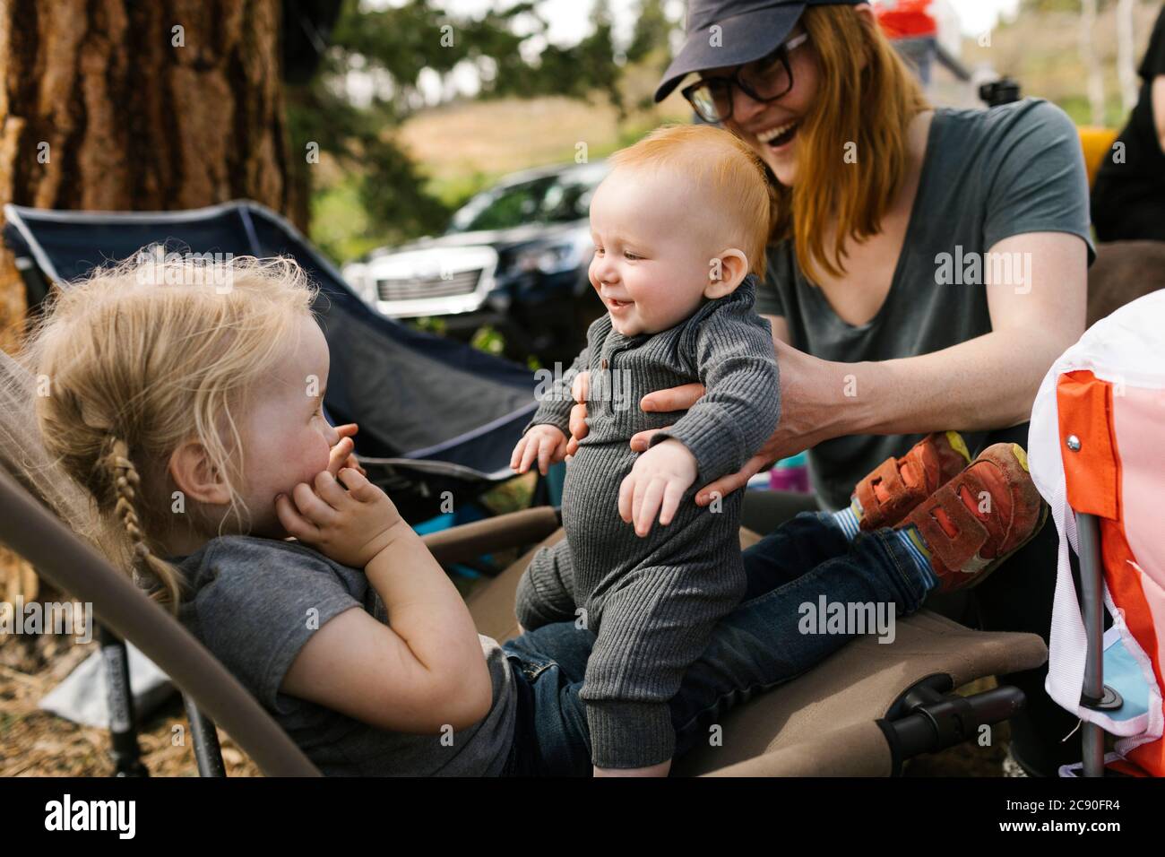 Mother playing with children (6-11 months, 2-3 Stock Photo - Alamy