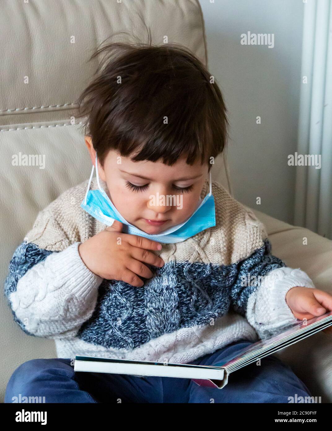 Boy wearing face mask holding hi-res stock photography and images - Alamy