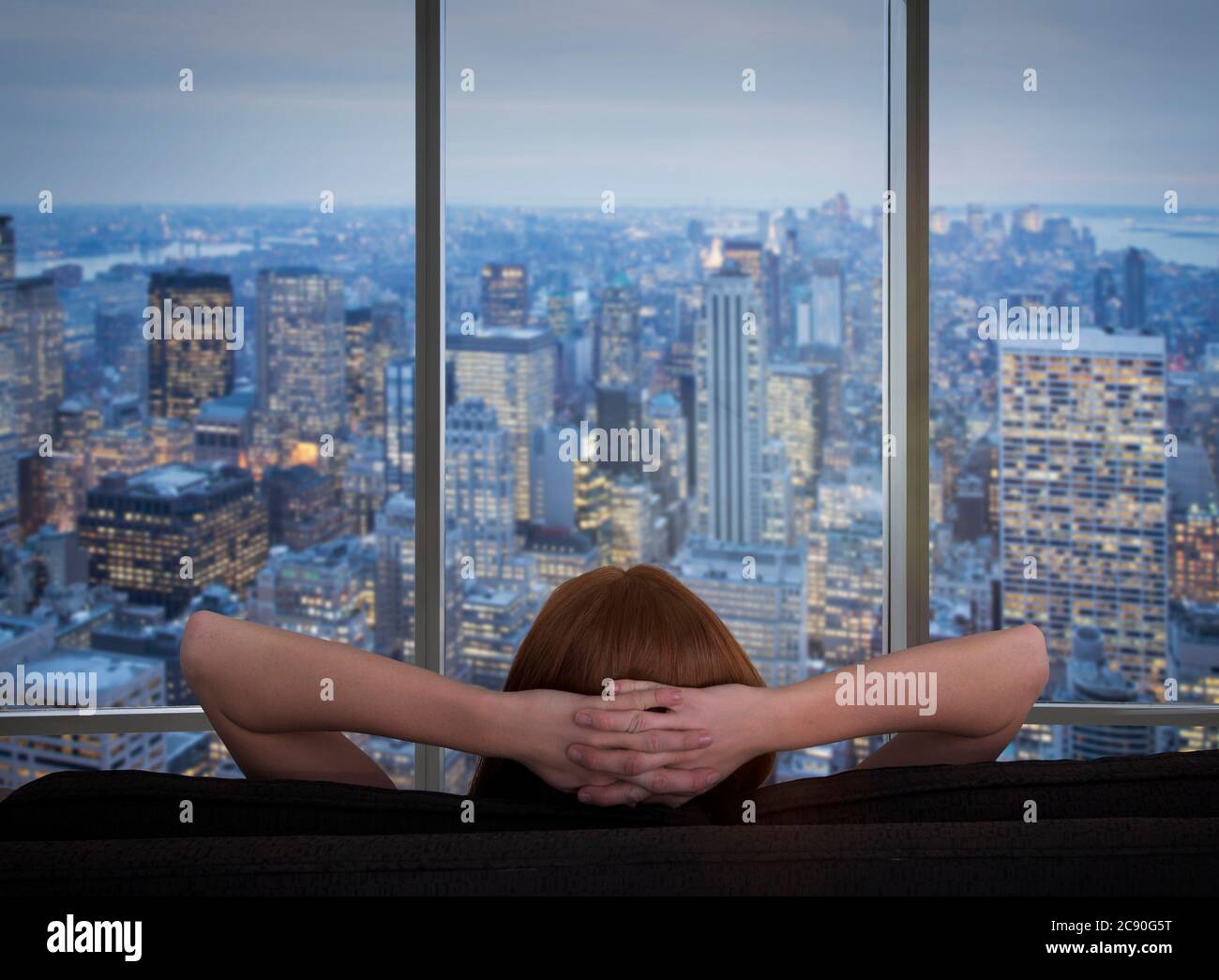 USA, New York, New York City, Woman looking at cityscape through window ...