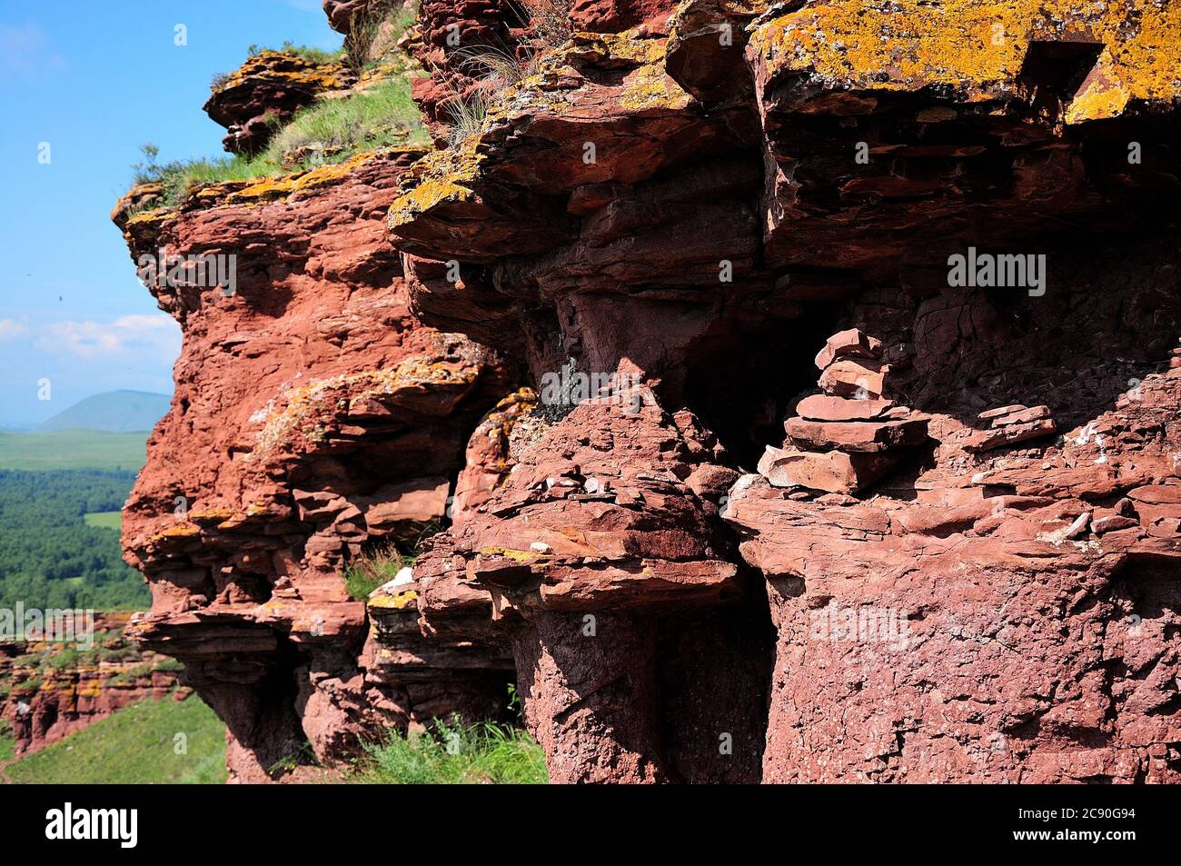 Rocks at the top of the hill of bizarre shape, worked over millennia by ...