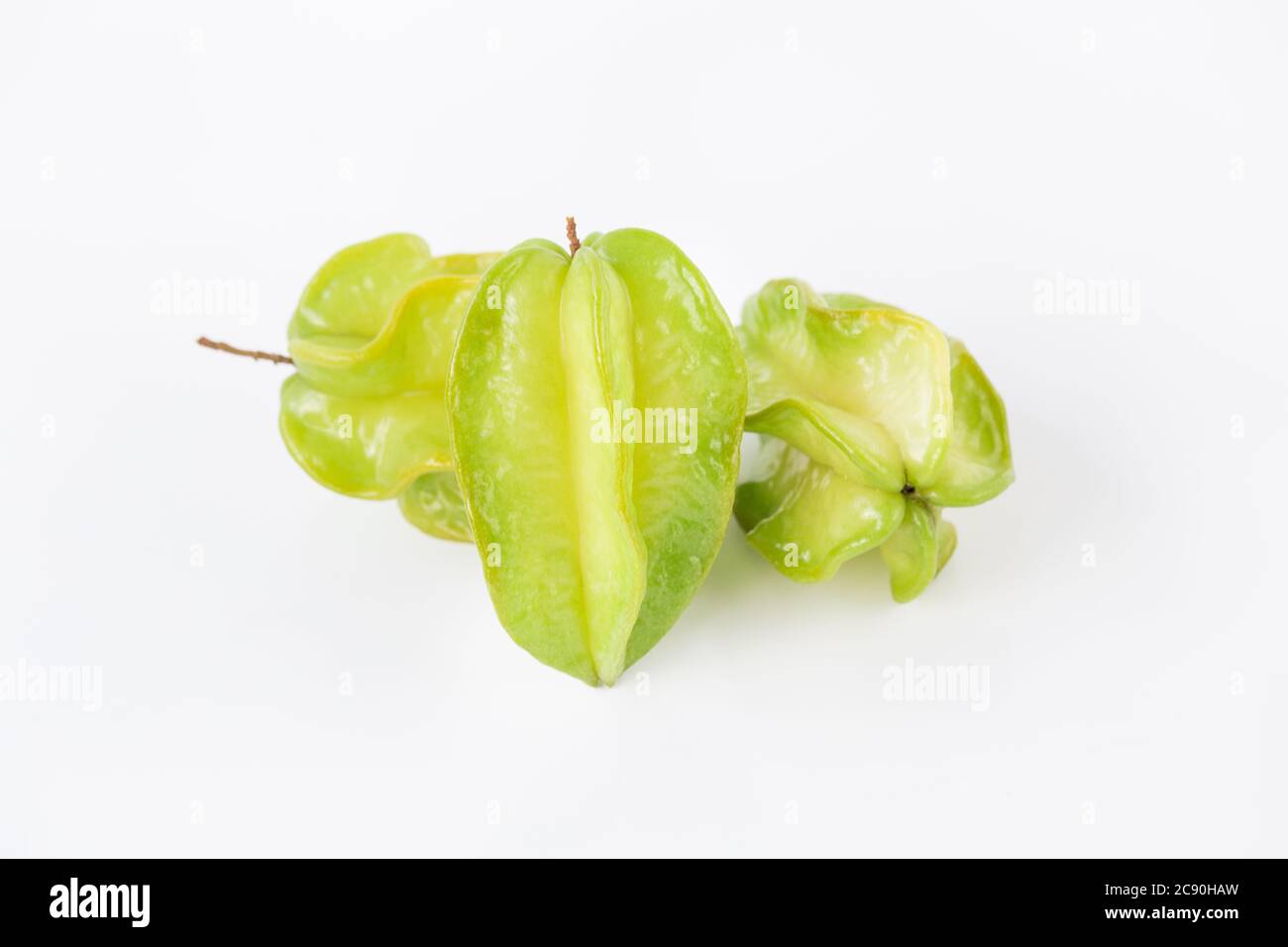 Fresh starfruit on the white background Stock Photo - Alamy