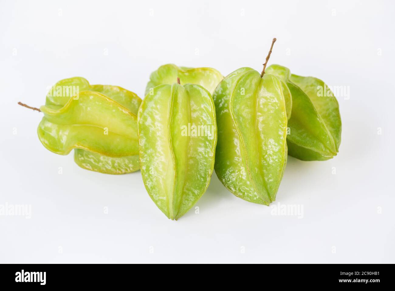 Fresh starfruit on the white background Stock Photo - Alamy