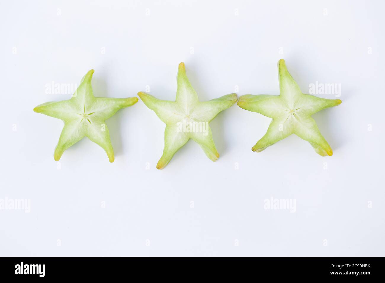 Fresh starfruit on the white background Stock Photo - Alamy