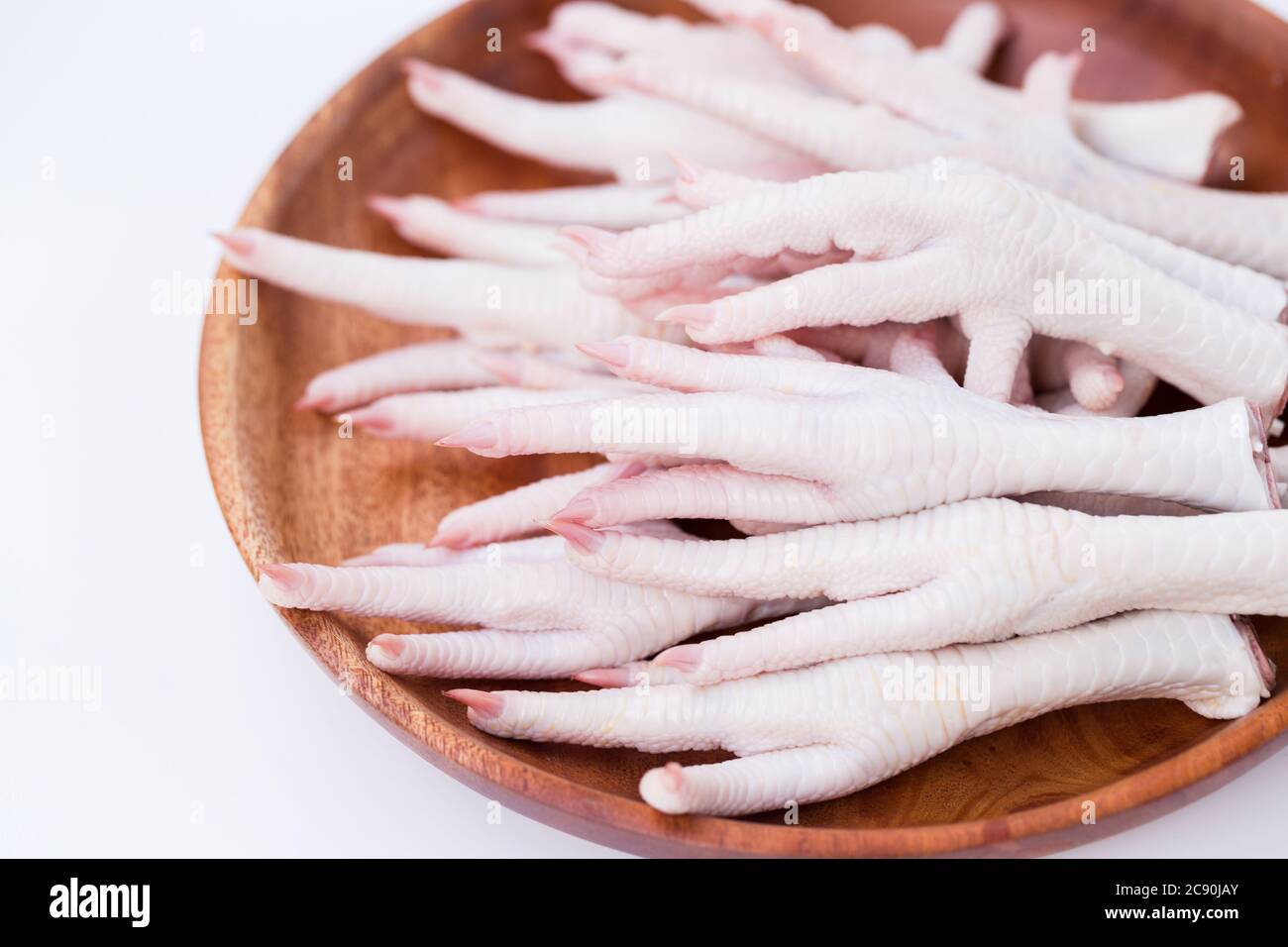 Fresh chicken feet Stock Photo - Alamy