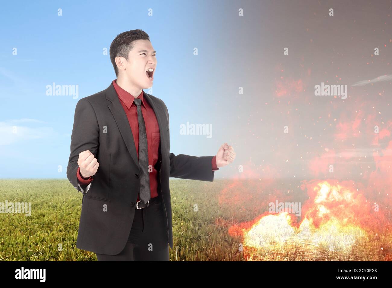 Asian businessman angry looking at burning ground on the field. Concept ...