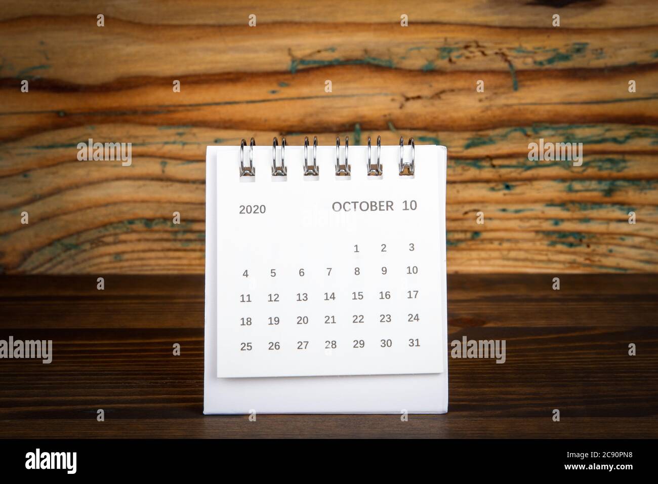 2020 OCTOBER. White paper calendar on a wooden table. Time planning ...