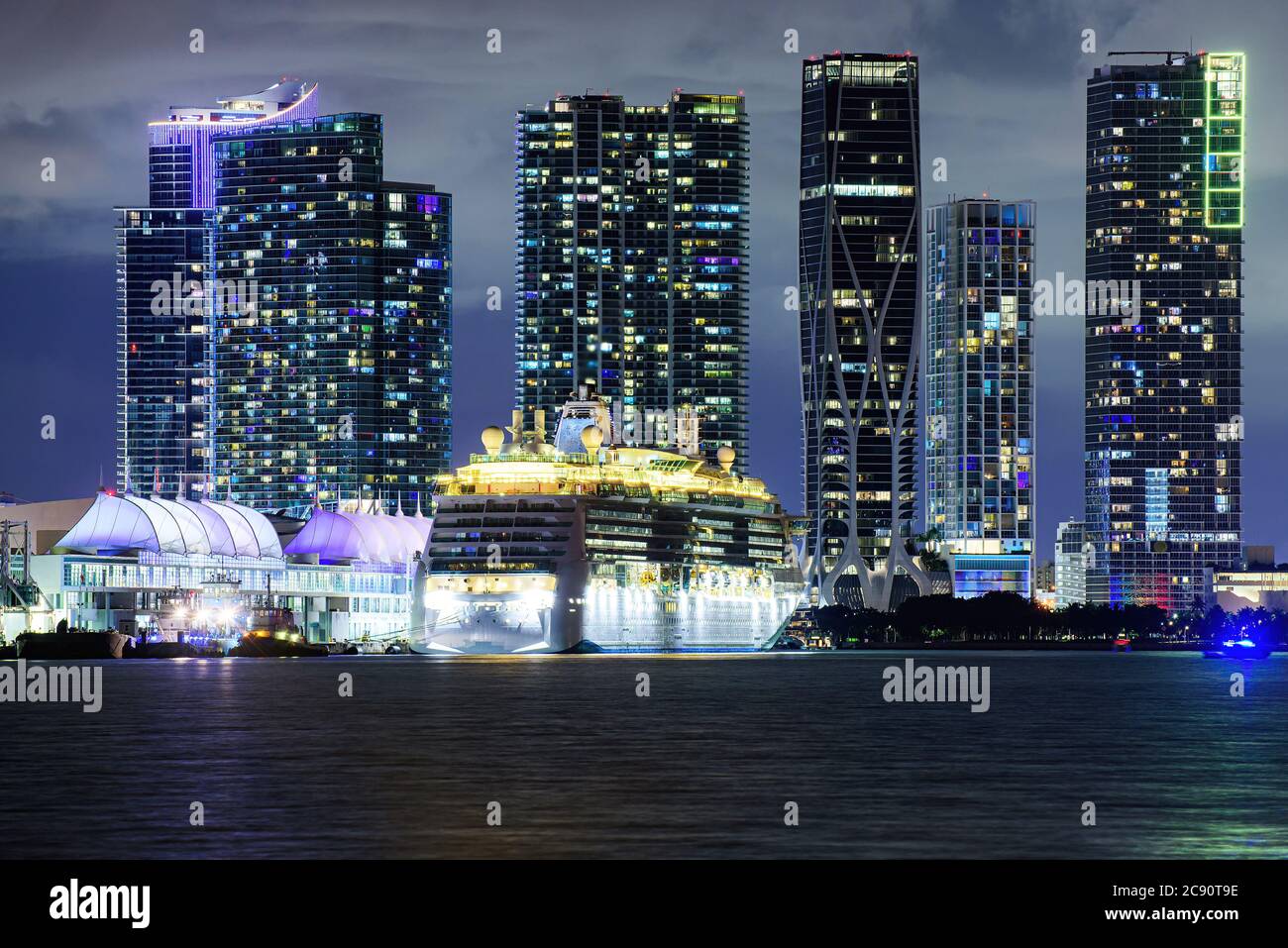 Miami night downtown. Cruise ship in the Port of Miami at sunset with ...