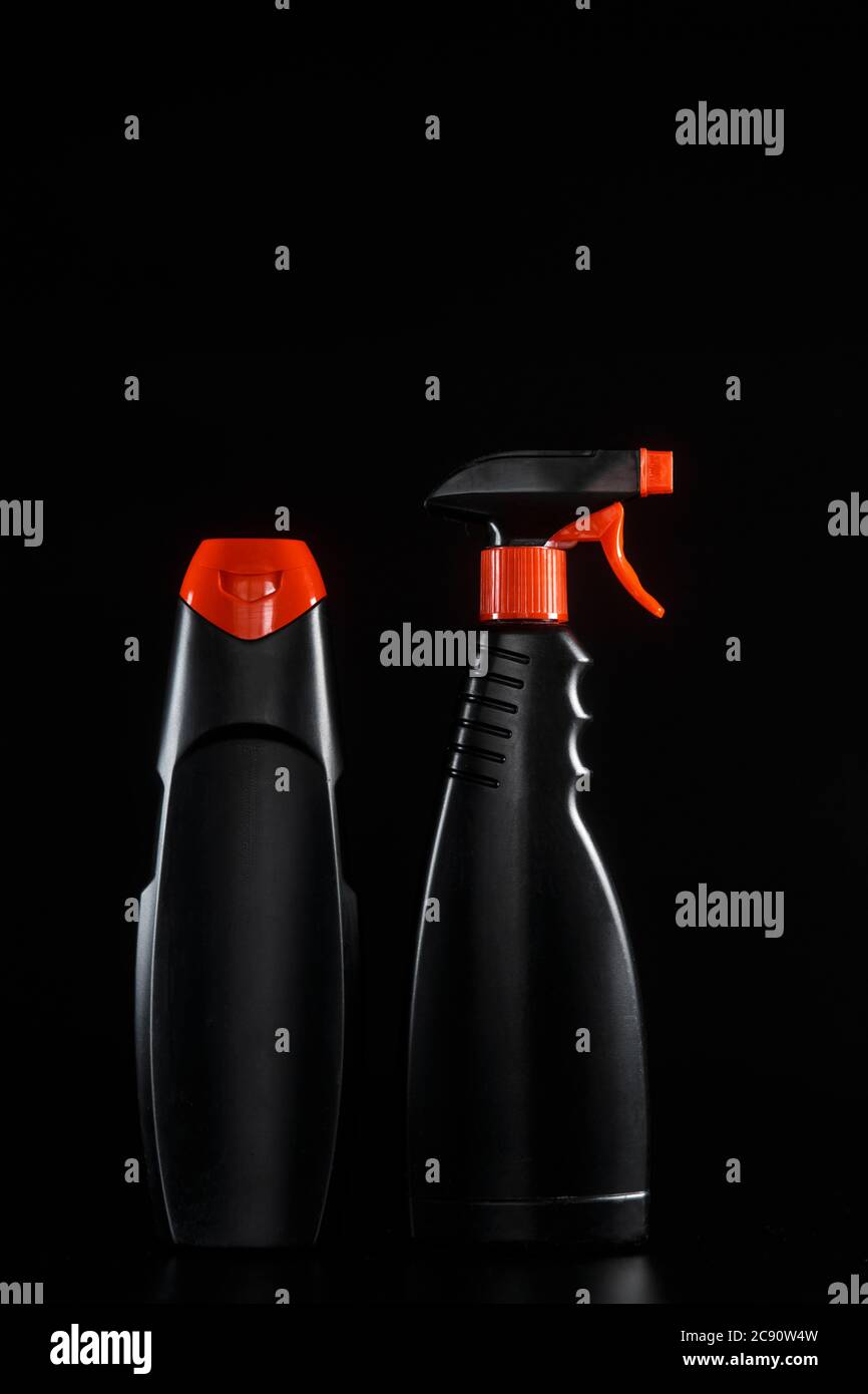 house cleaner, black spray and black rust remover on a black background ...