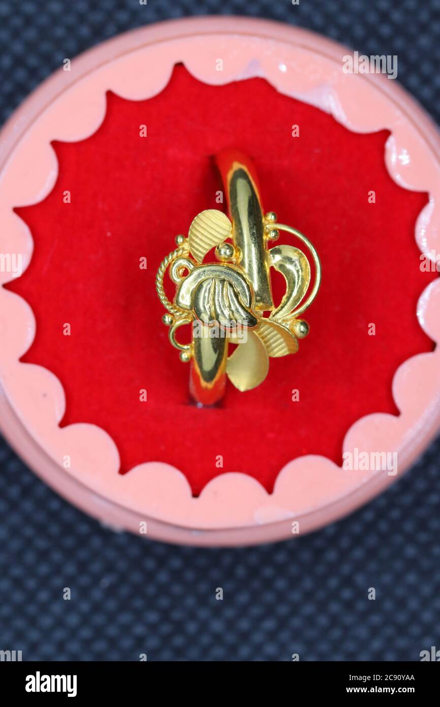 Shiny fancy gold ring designs for girls (jewels catalog Stock Photo - Alamy