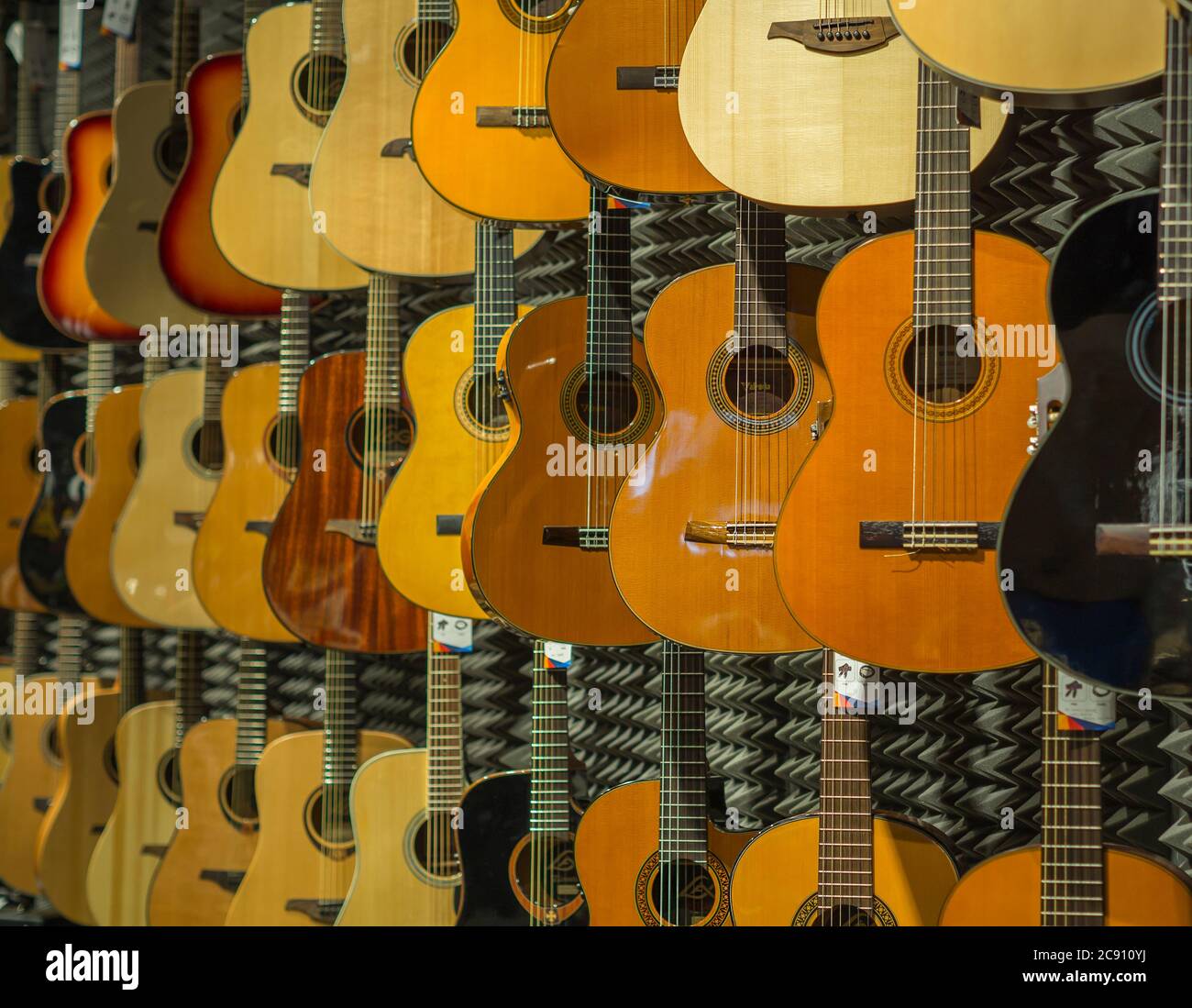 classical acoustic guitar background music shop with many guitars Stock ...