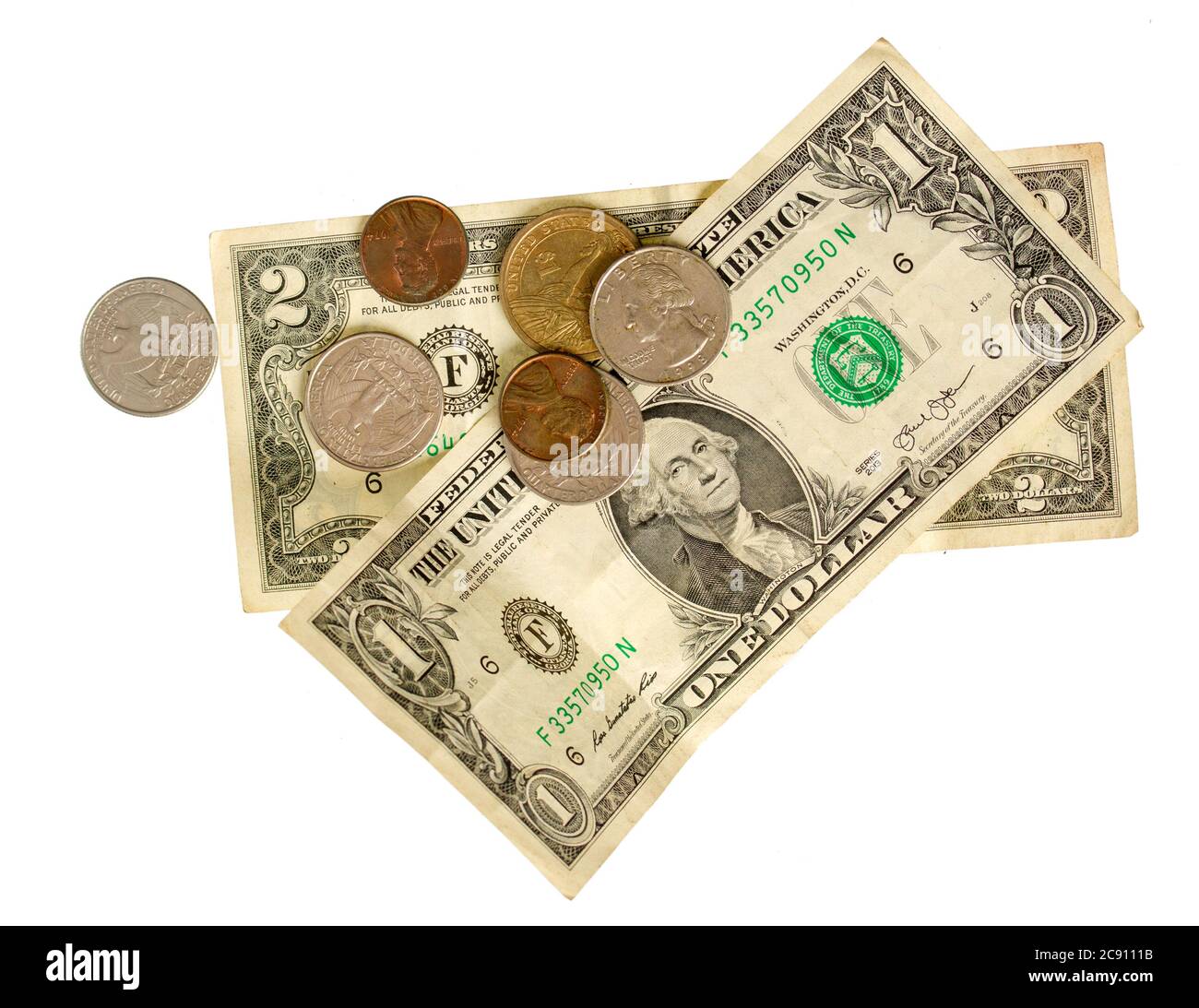 small crumpled dollar bills and coins isolated on white background ...