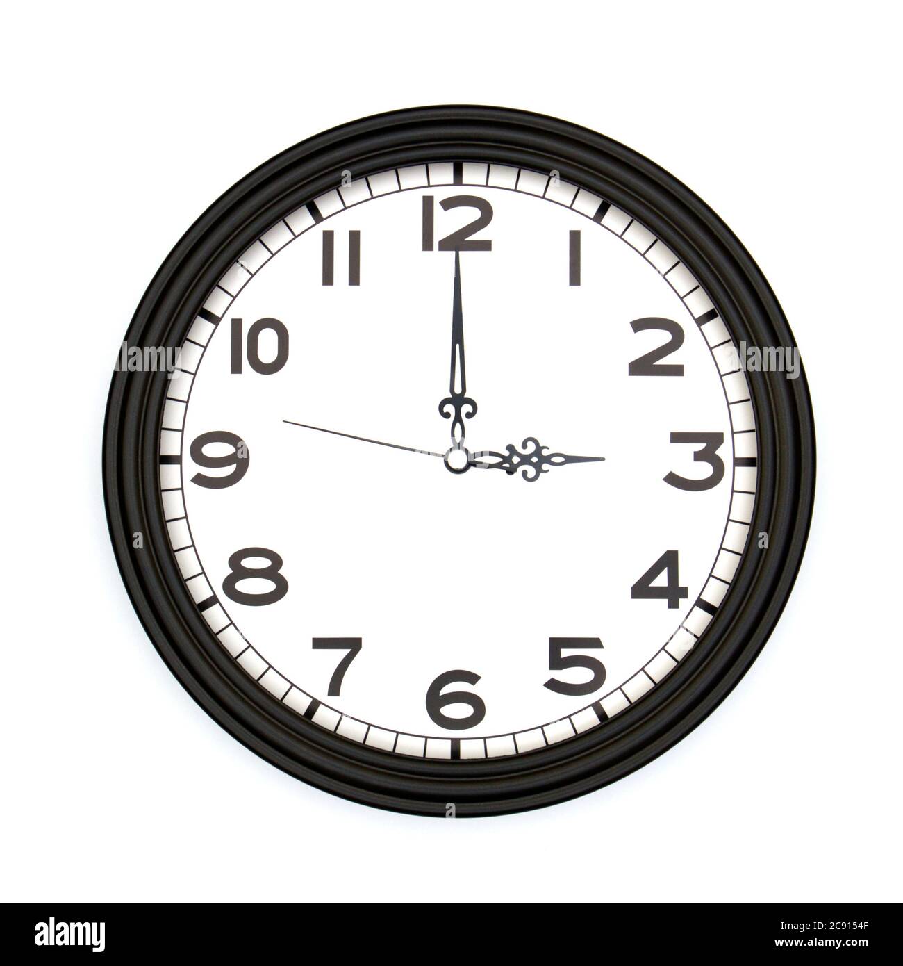 Black round analog wall clock isolated on white background, its three ...