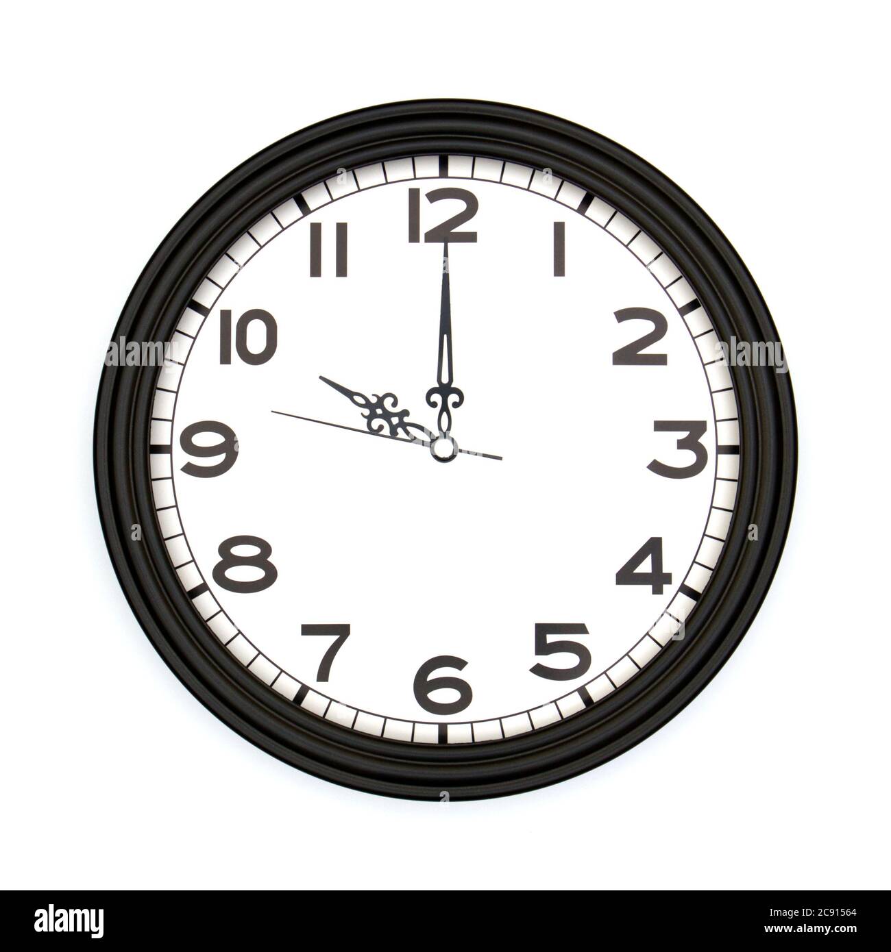 Black round analog wall clock isolated on white background, its ten ...