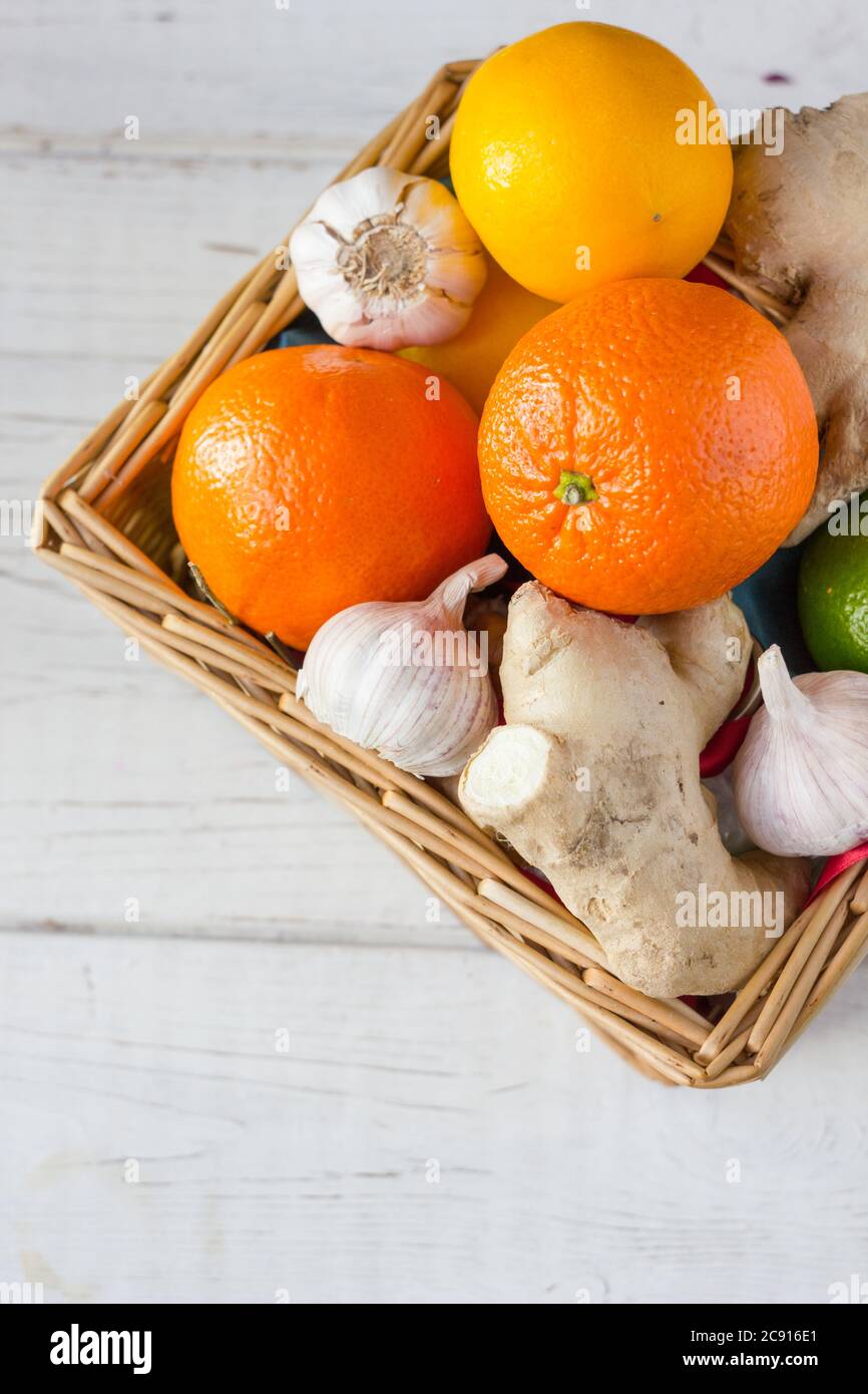 Citrus fruits, garlic and ginger root on basket Stock Photo - Alamy