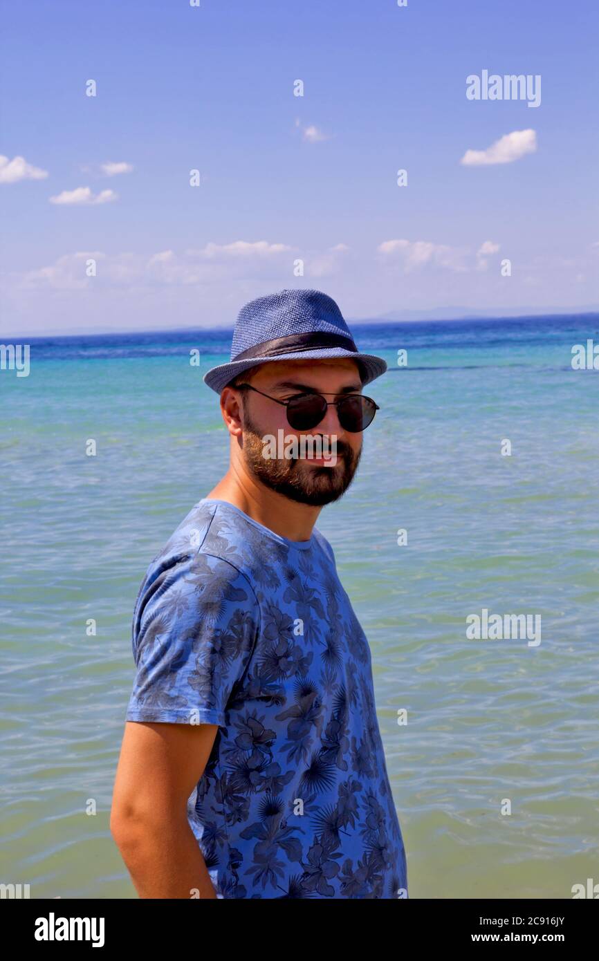 Man with blue hat hi-res stock photography and images - Alamy