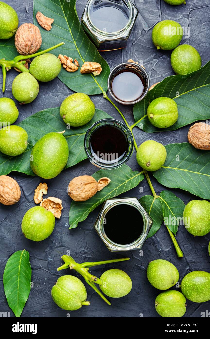 Healing tincture of unripe walnut.Green walnut in herbal medicine Stock ...