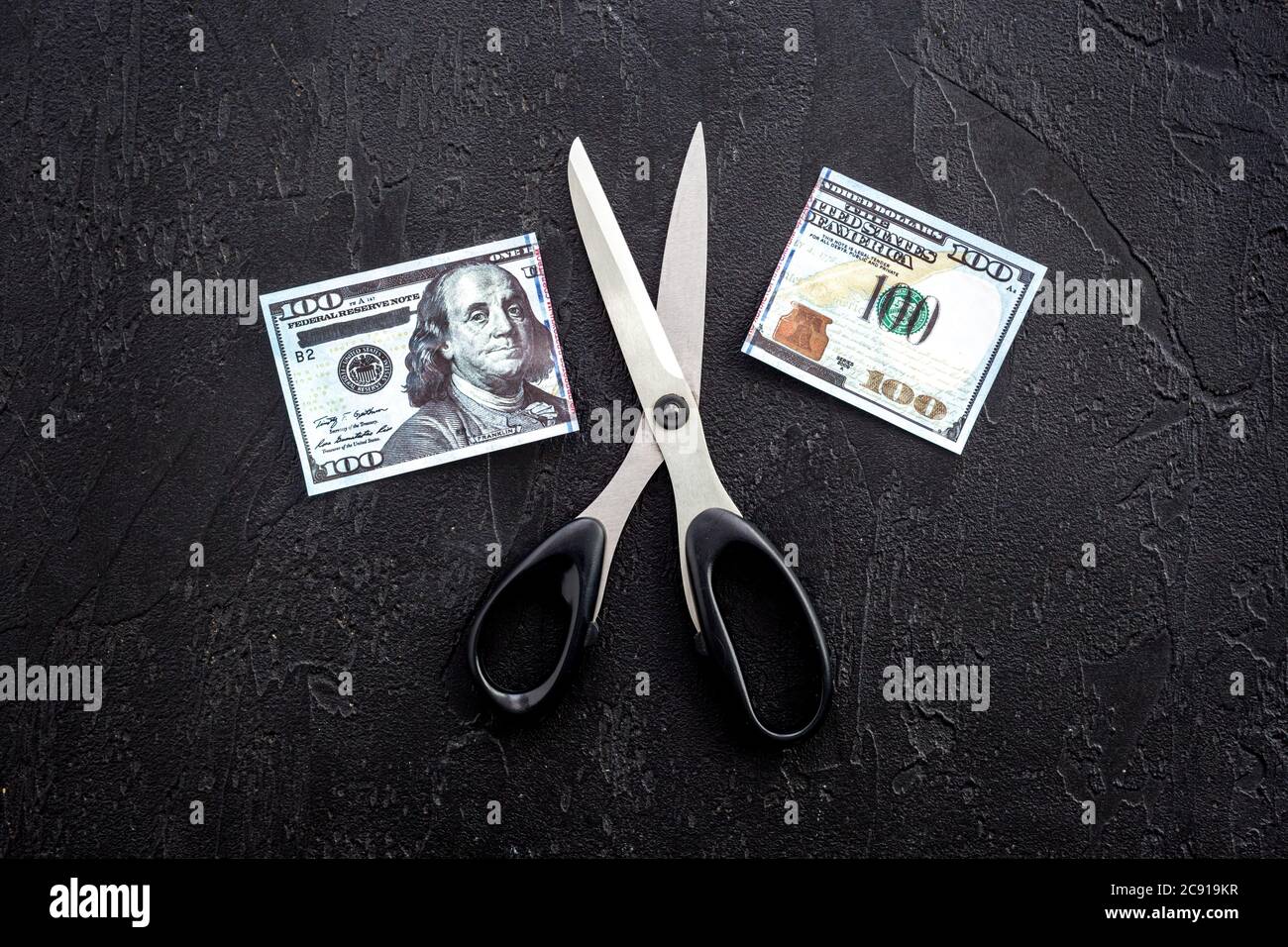 Decline of dollar exchange rate. Scissors cut dollars banknote Stock ...