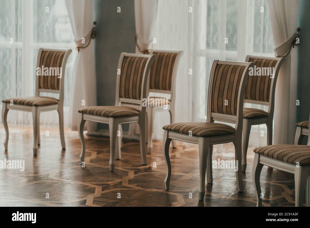 Close up of chairs in room. Beautiful seats in hall for festive events ...