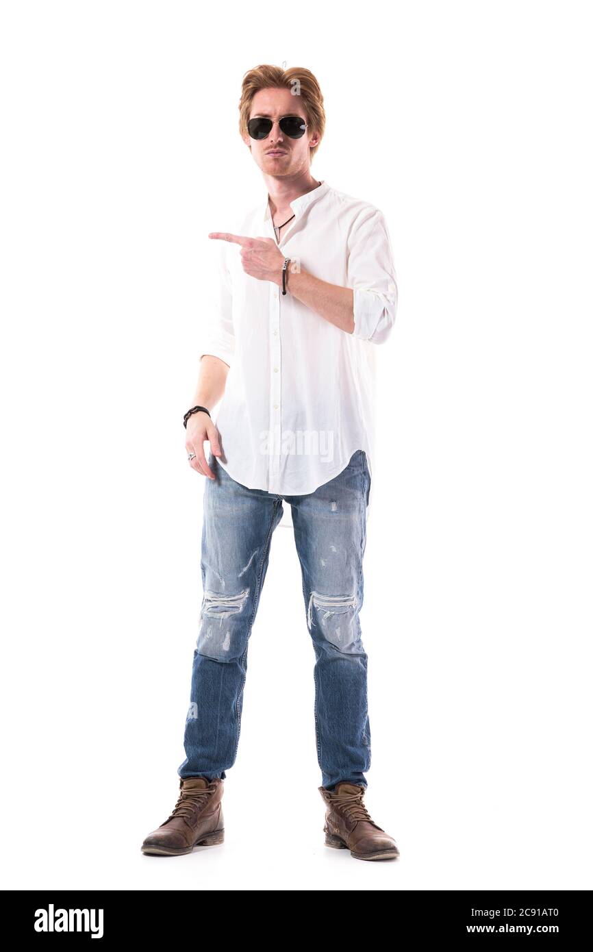 Displeased young strict man showing the doors ordering you to leave ...