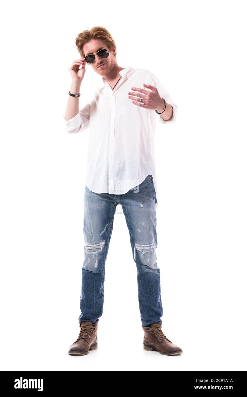 Happy confident young stylish man calling and inviting you beckoning ...