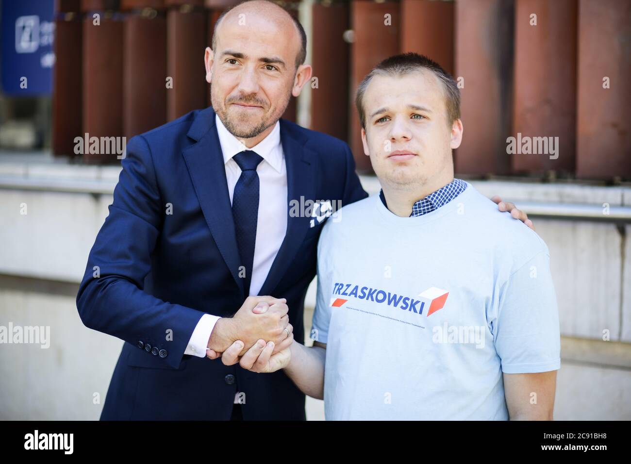 Borys Budka poses for a photo with his young supporter after press ...