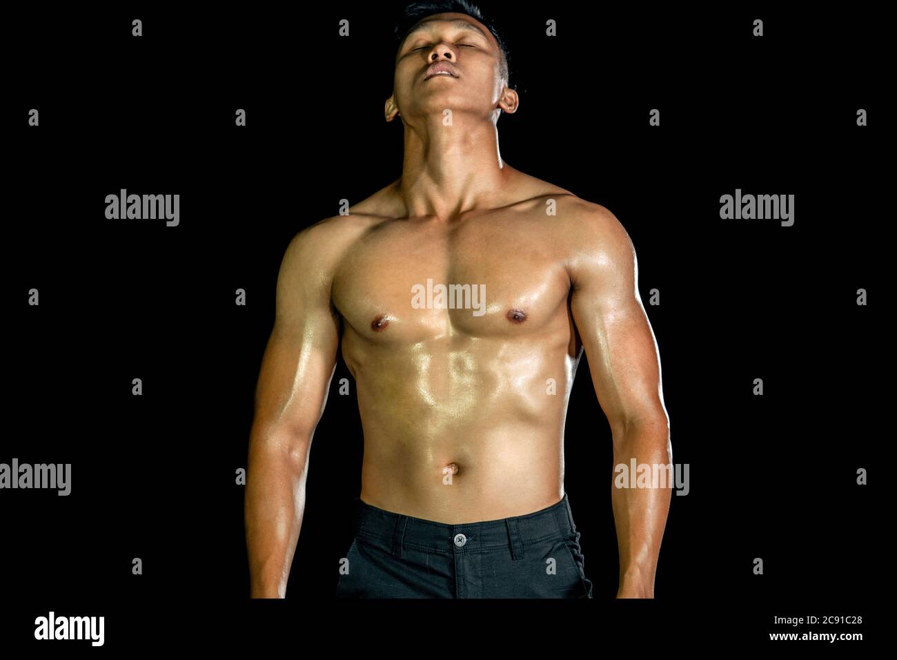 Muscle bodybuilder asia men posing muscle front on the black background ...