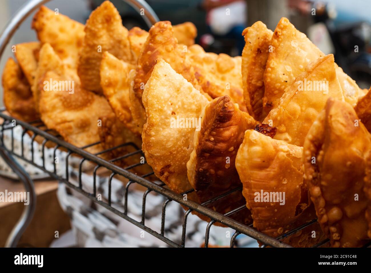 Traditional plain snacks, fried on deep oil, for buying in streets in ...
