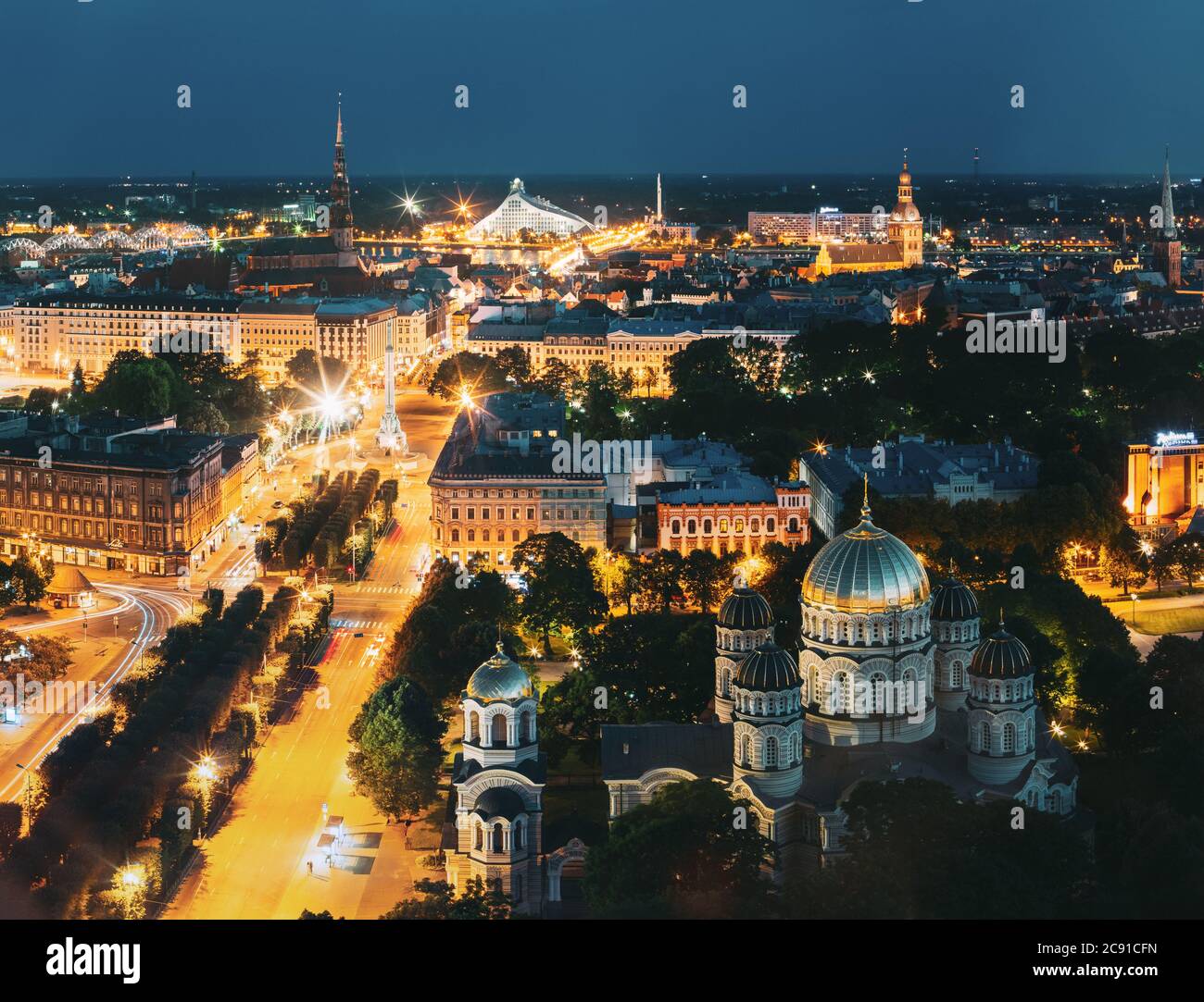 Riga, Latvia. Cityscape With Famous Landmarks St. Peter's Church ...