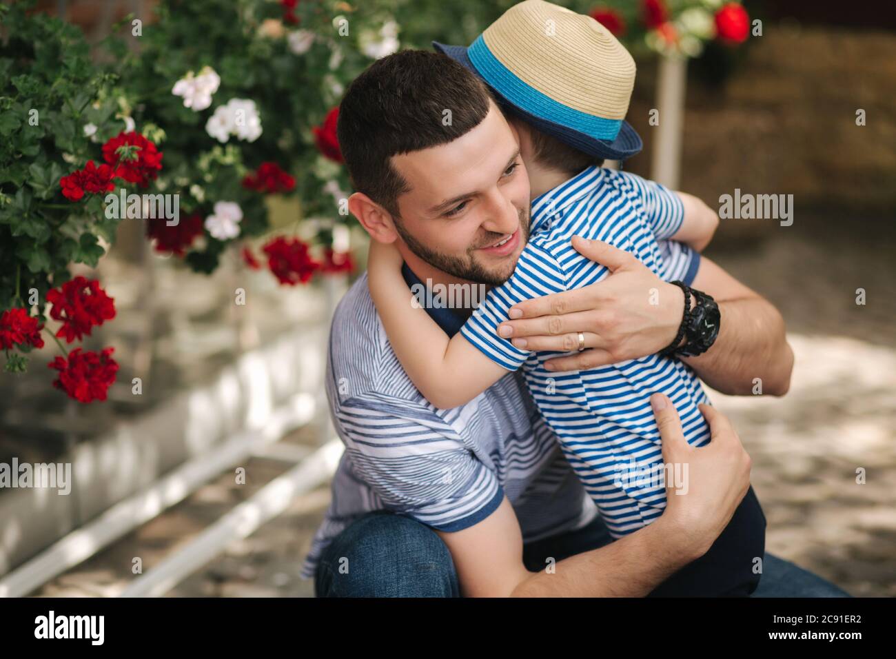 Happy dad with his little sun outdoors. Sun hug his father Stock Photo ...