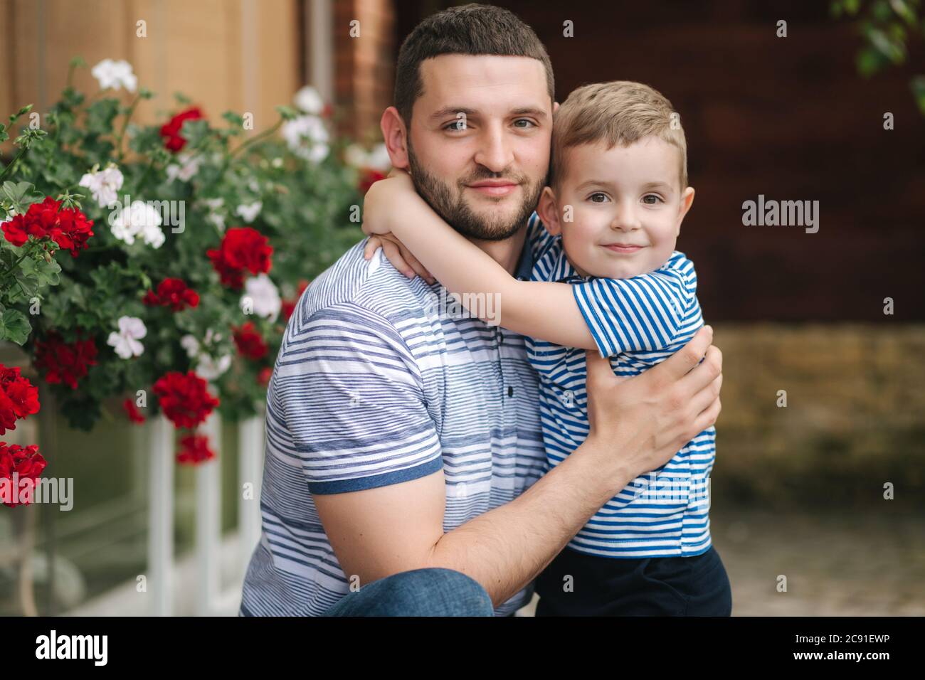 Happy dad with his little sun outdoors. Sun hug his father Stock Photo ...